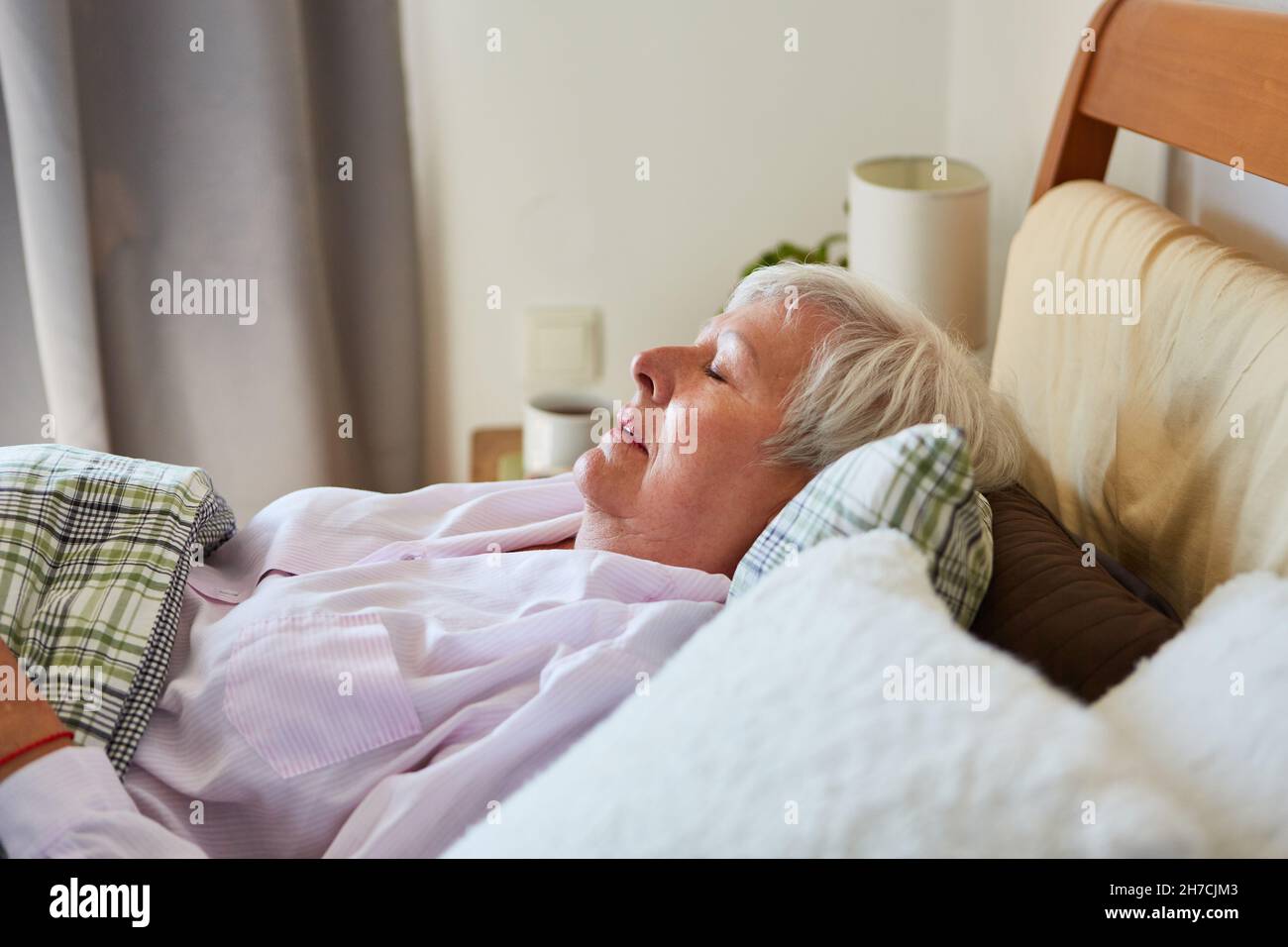 Old woman taking a nap or as a patient in the hospital or at home Stock ...