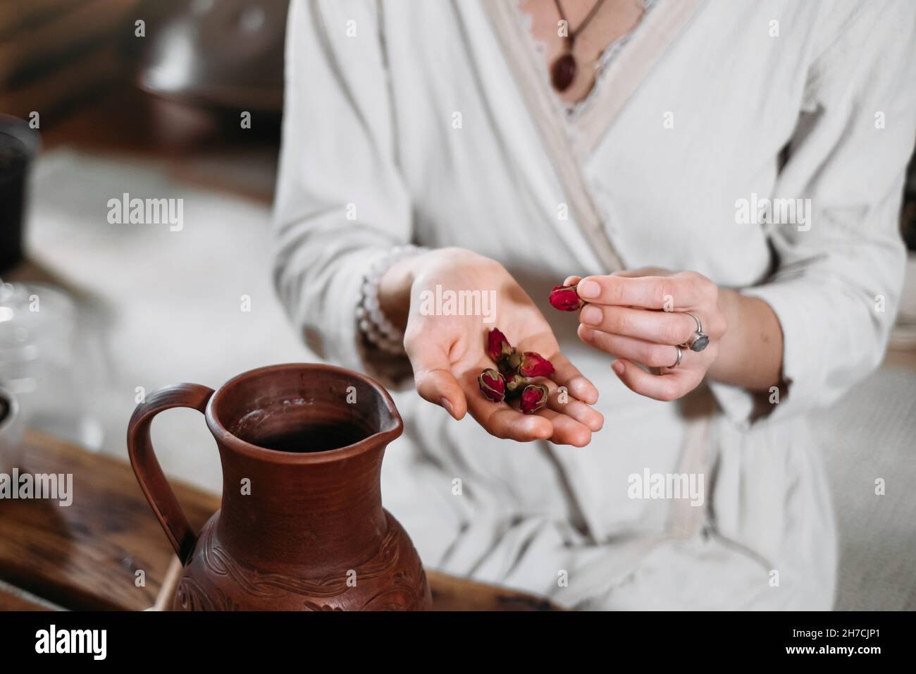 Cacao ceremony in atmospheric space with green plants and candles ...
