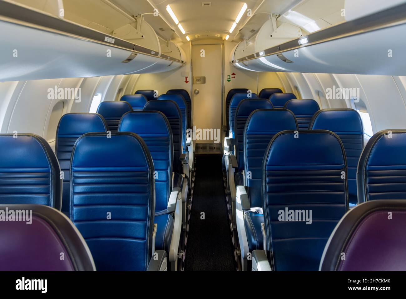 Interior cabin of a passenger plane with leather chair for passenger ...