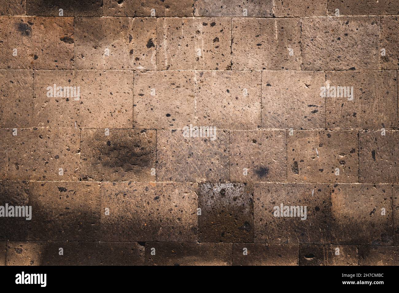 Background in the form of a dark stone masonry in the wall of an ...