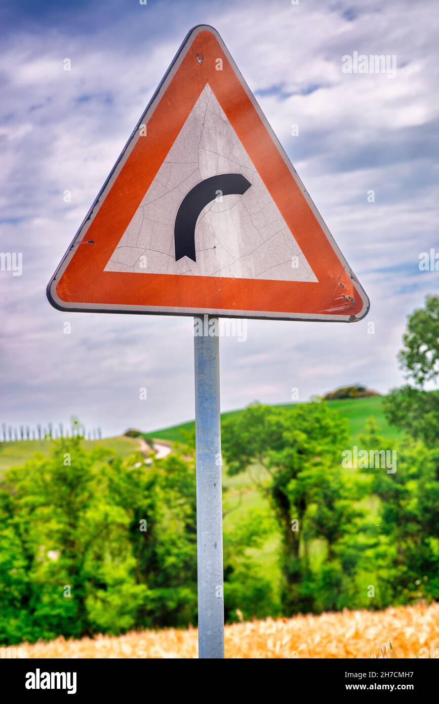 Danger of curved track sign in the countryside Stock Photo - Alamy
