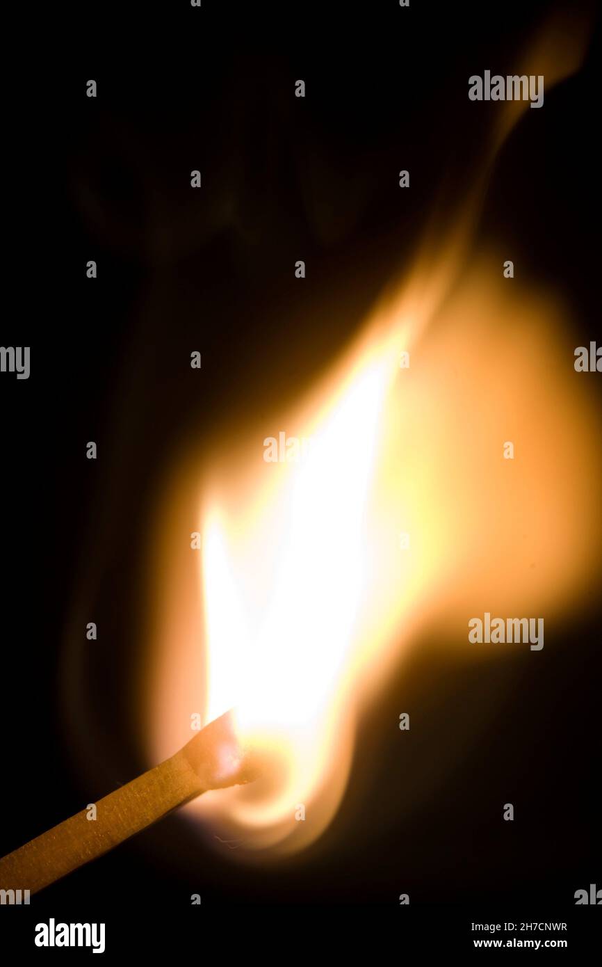 bruning match against black background Stock Photo - Alamy