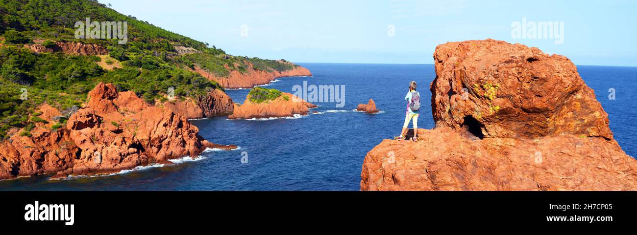 woman at theon a rock in the area of Esterel, France, Dept. Var, Saint ...