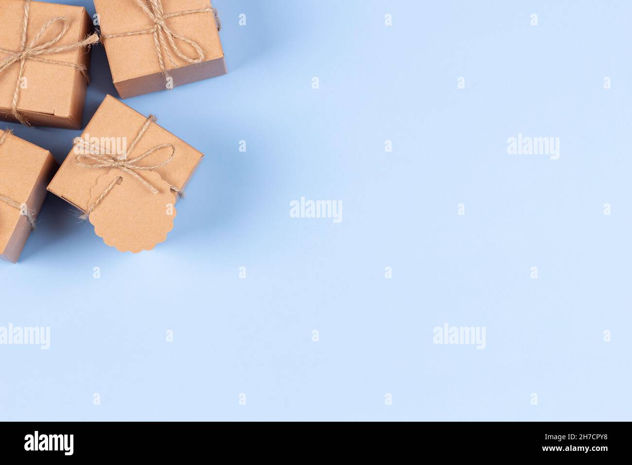 Top view to small brown present gift boxes. One small box with blank ...