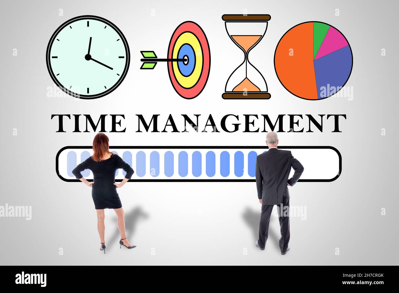 Time management concept drawn on a wall watched by business people ...