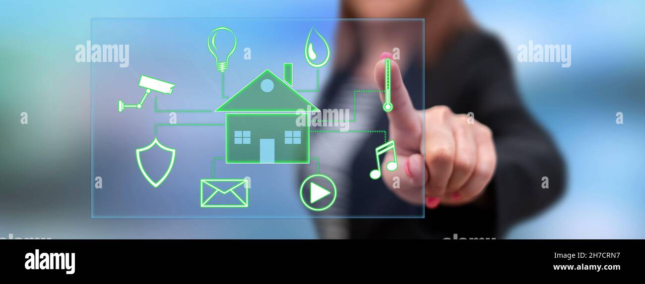 Woman touching a digital smart home automation concept on a touch ...