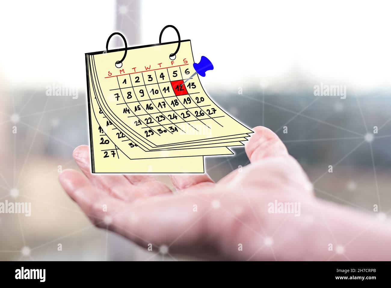 Calendar concept above a hand of a man Stock Photo - Alamy