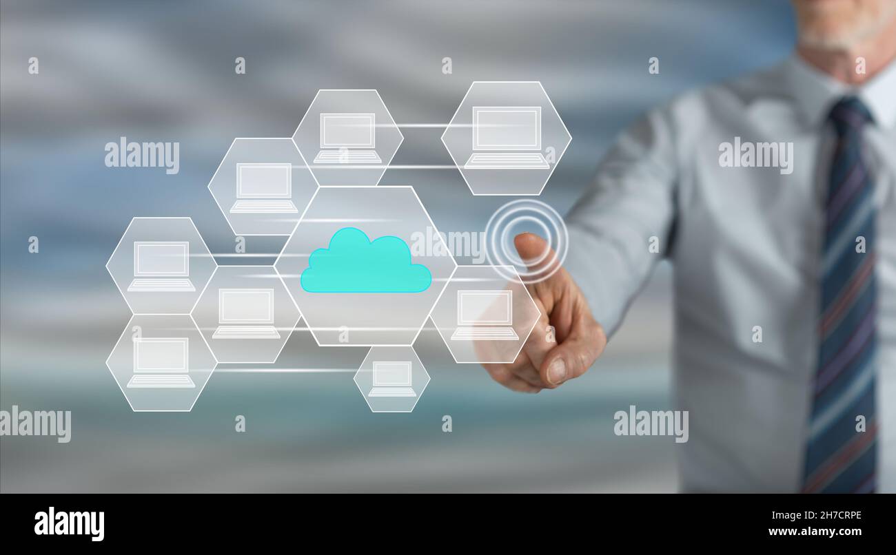 Man touching a cloud computing concept on a touch screen with his ...
