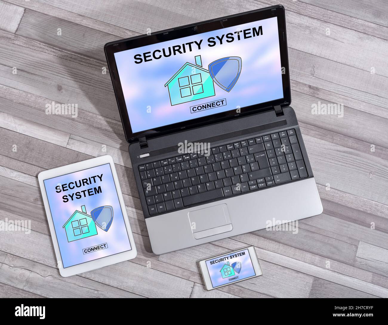 Home security system concept shown on different information technology ...