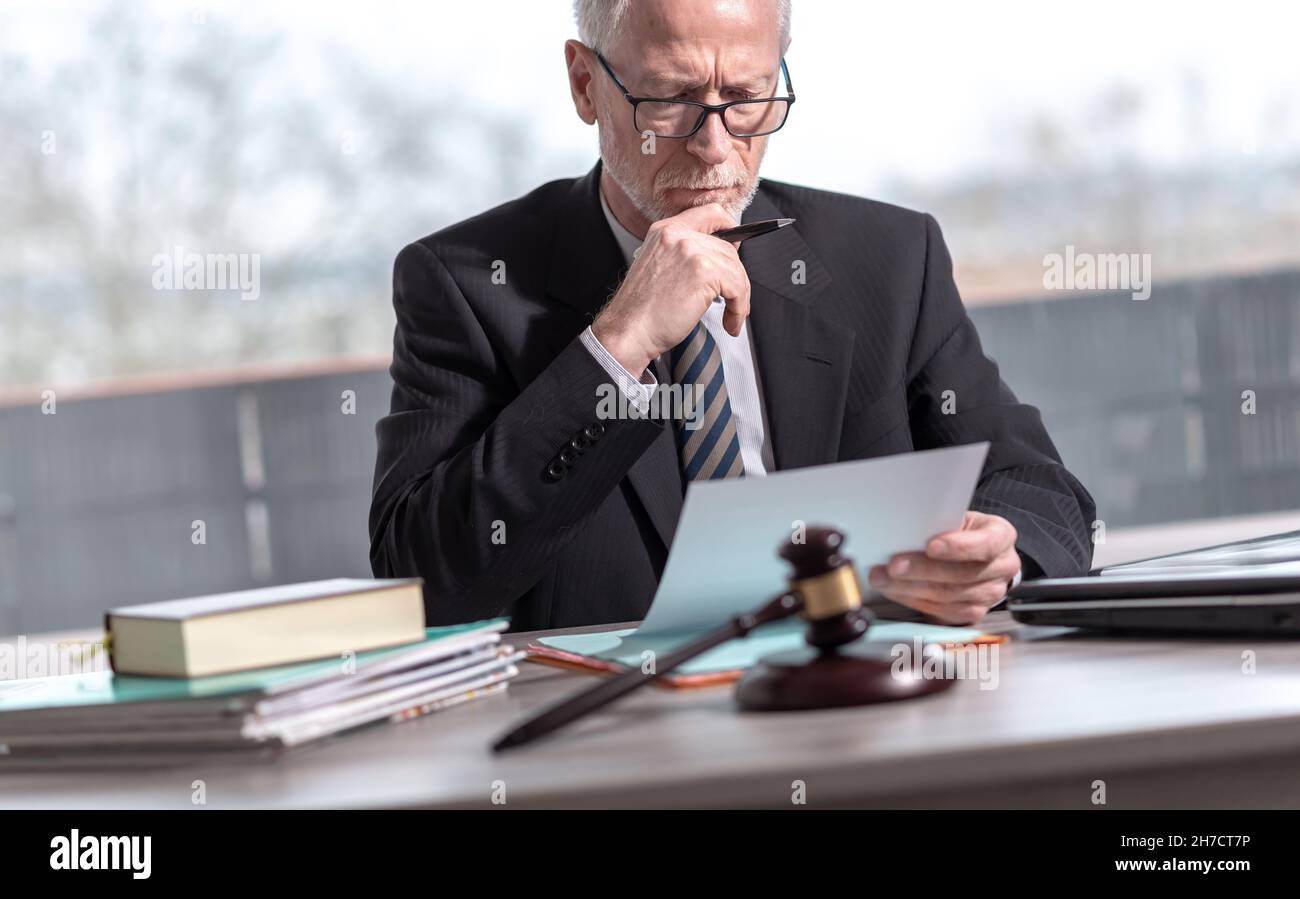 Lawyer working on legal document Stock Photo - Alamy