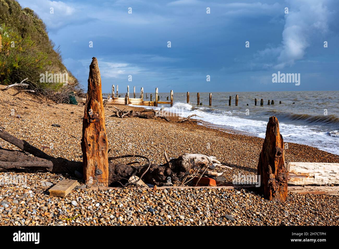 Eroded wooden groynes hi-res stock photography and images - Alamy