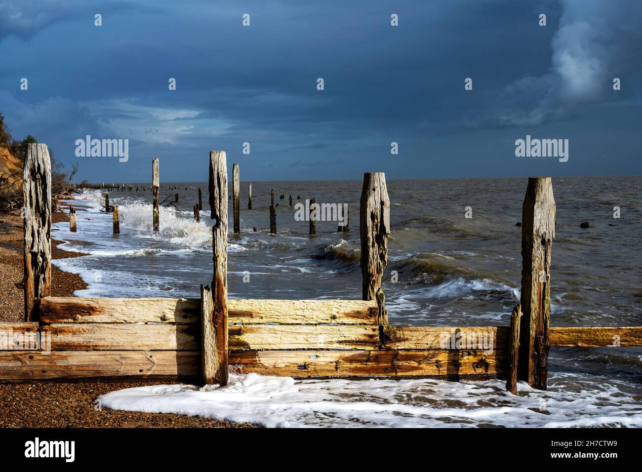Eroded wooden groynes hi-res stock photography and images - Alamy