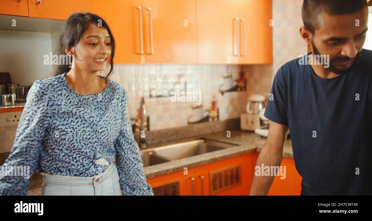 Young Indian couple arguing in a kitchen Stock Photo - Alamy