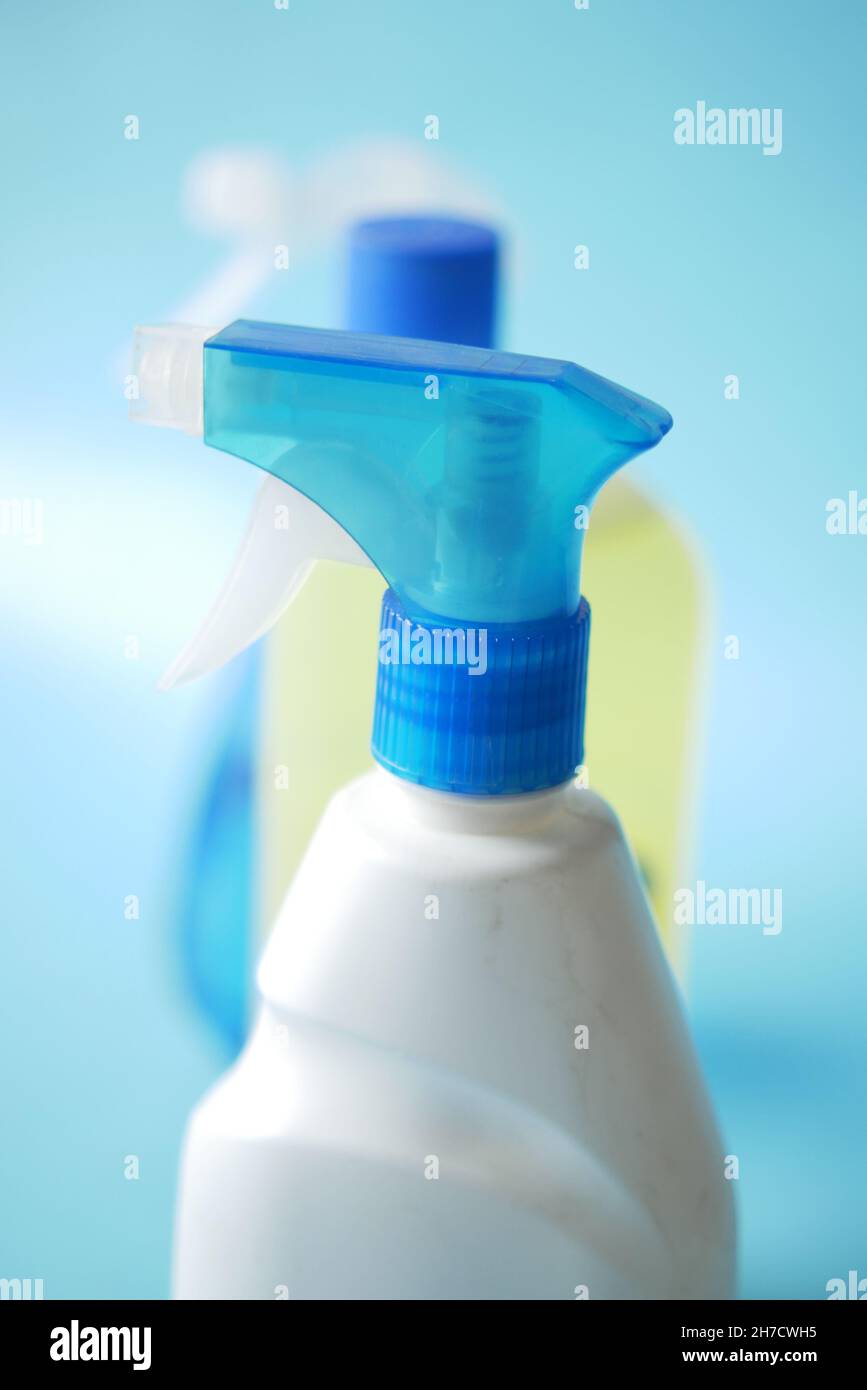 disinfect spray bottles on blue background Stock Photo - Alamy