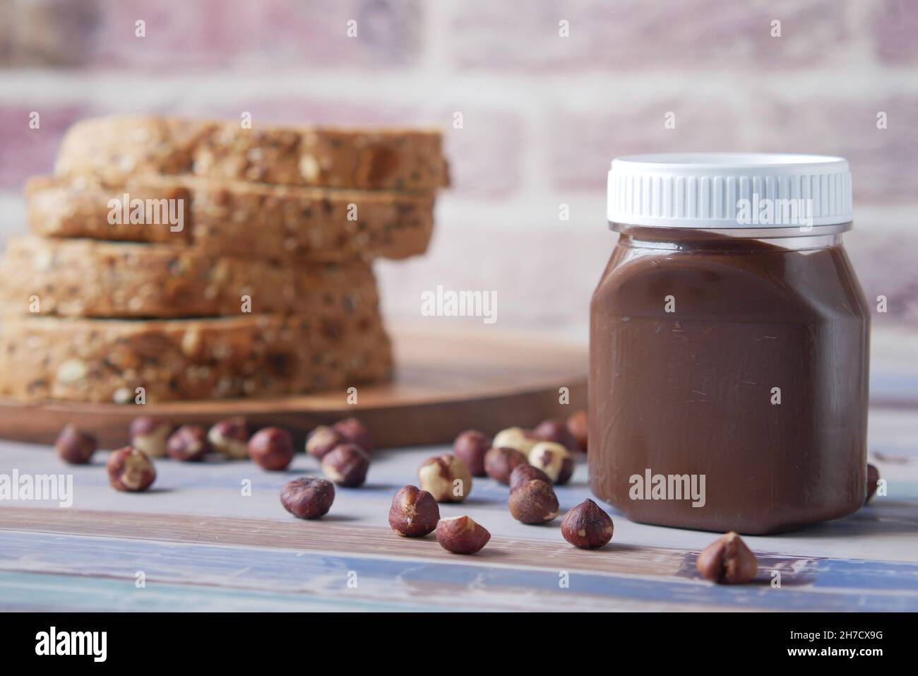 Chocolate Hazelnut cream in a container on table Stock Photo - Alamy