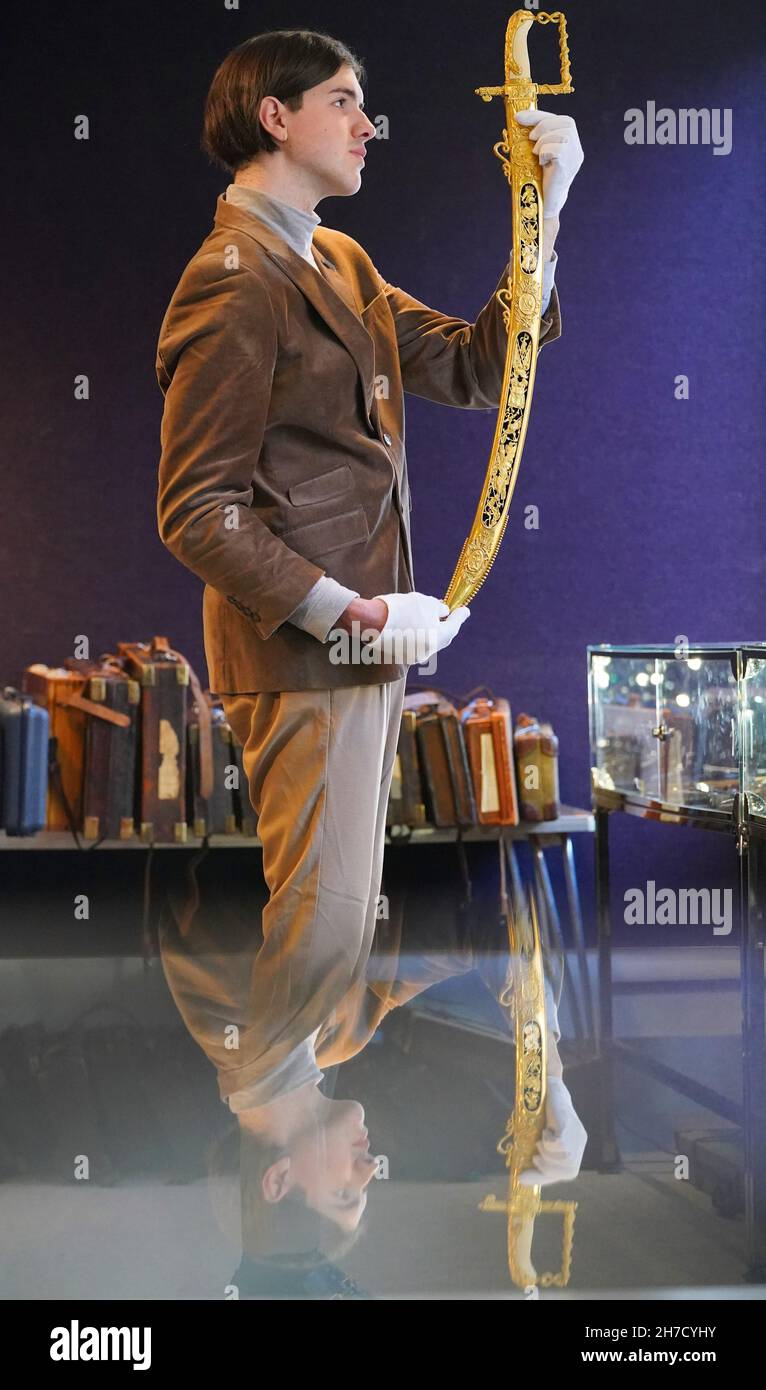 A Bonhams employee displays the Lloyd's Patriotic Fund Trafalgar Sword ...