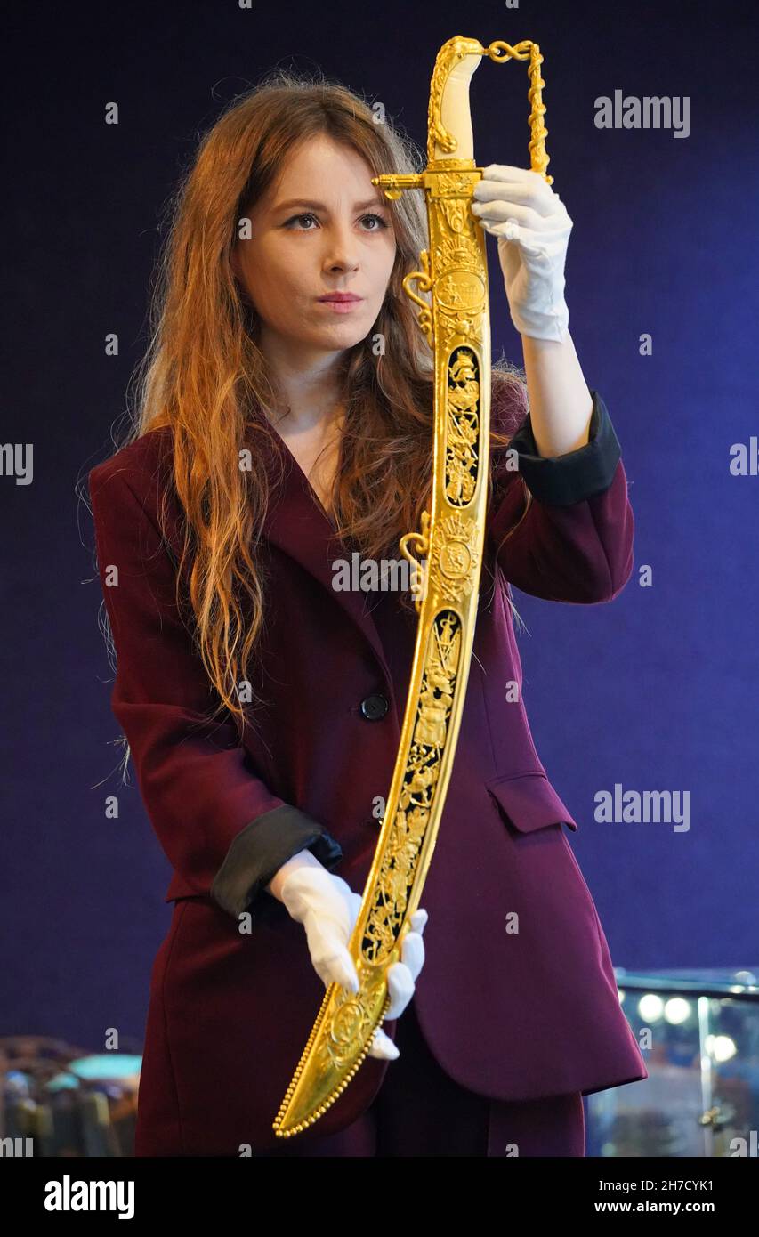 A Bonhams employee displays the Lloyd's Patriotic Fund Trafalgar Sword ...