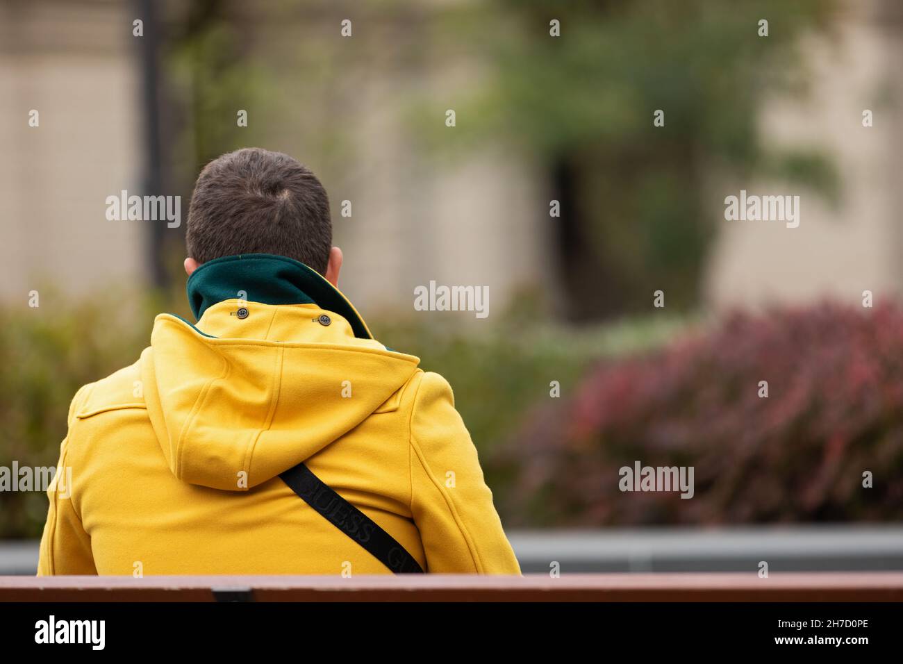 Photo of unrecognizable person sitting on an urban bench Stock Photo ...