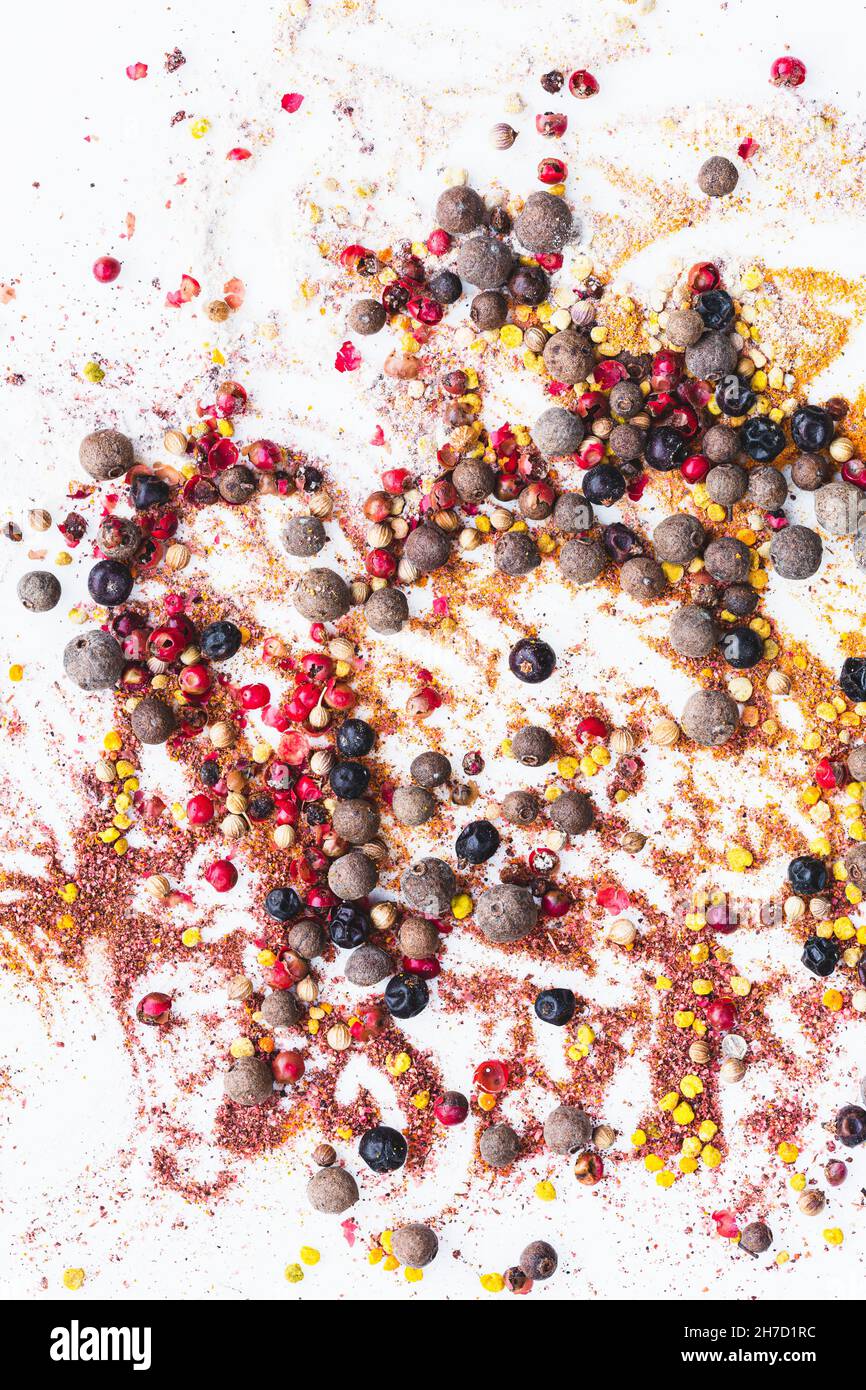 Directly above shot of scattered spices on white surface Stock Photo ...