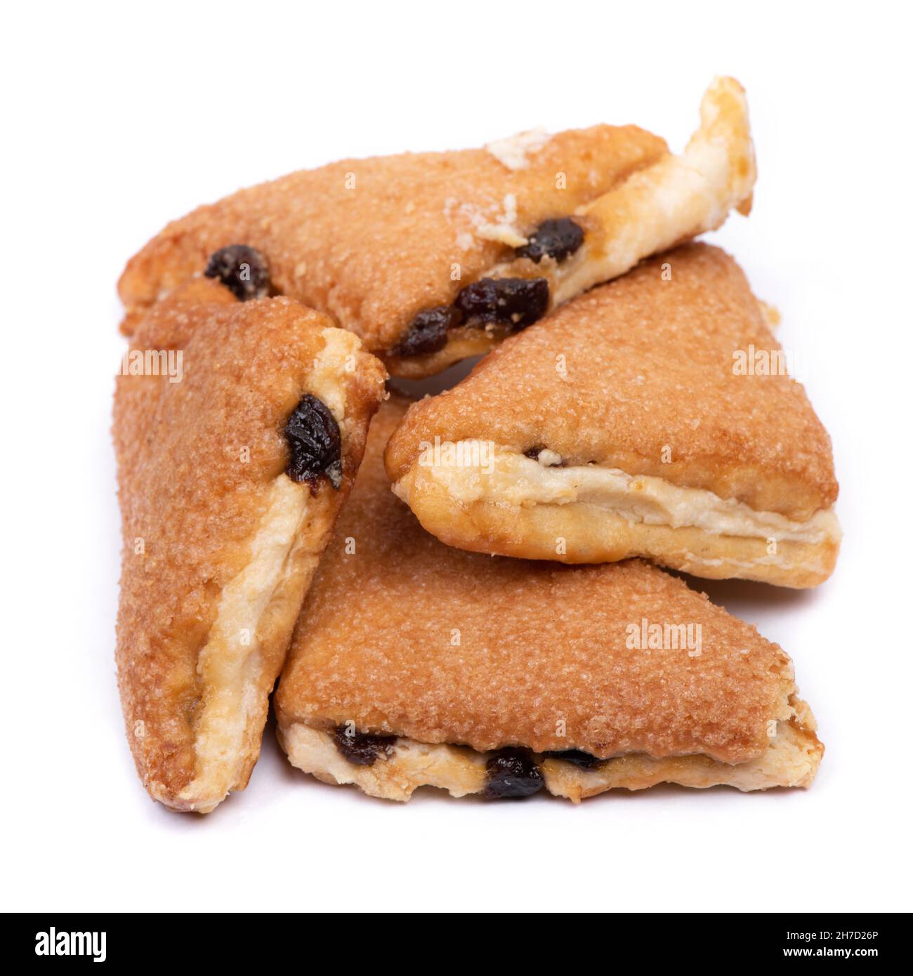 Group of triangular pastries with raisins isolated over white ...