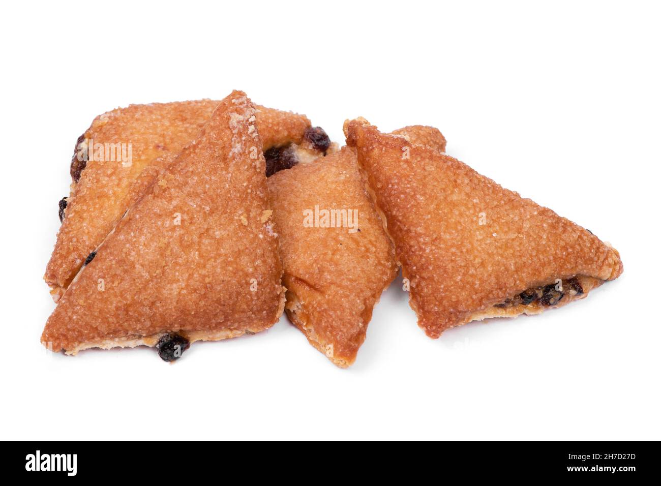 Baked goods with raisin in the shape of triangles isolated on white ...