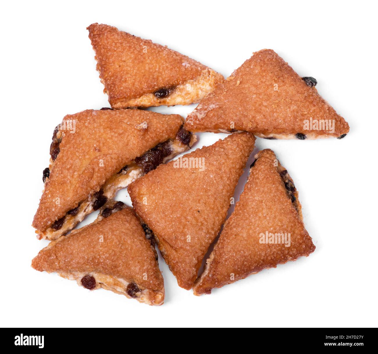 Baked goods with raisin in the shape of triangles isolated on white ...