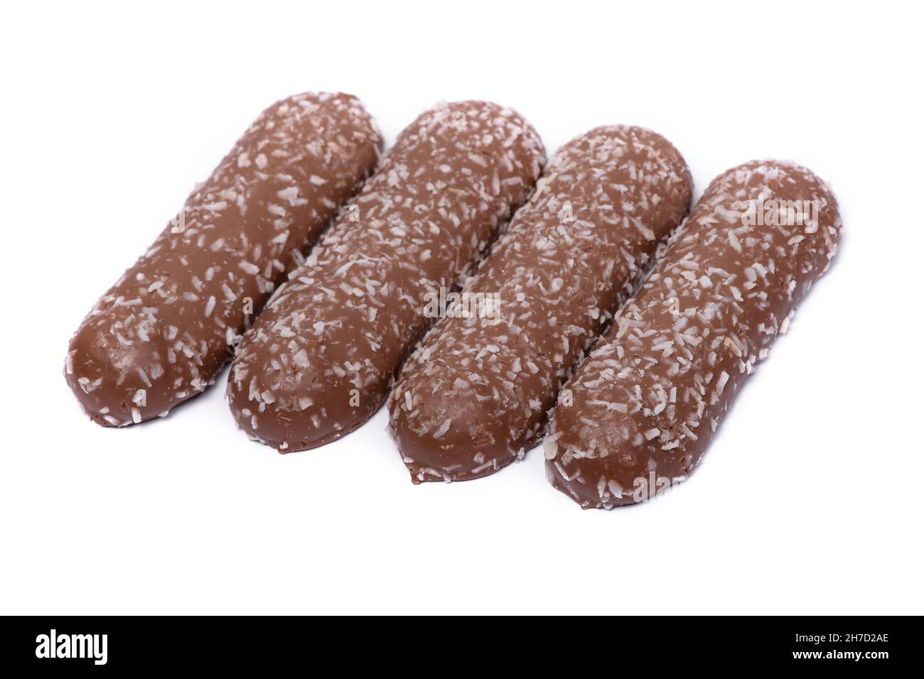 Group of long chocolate bars with coconut powder isolated on white ...