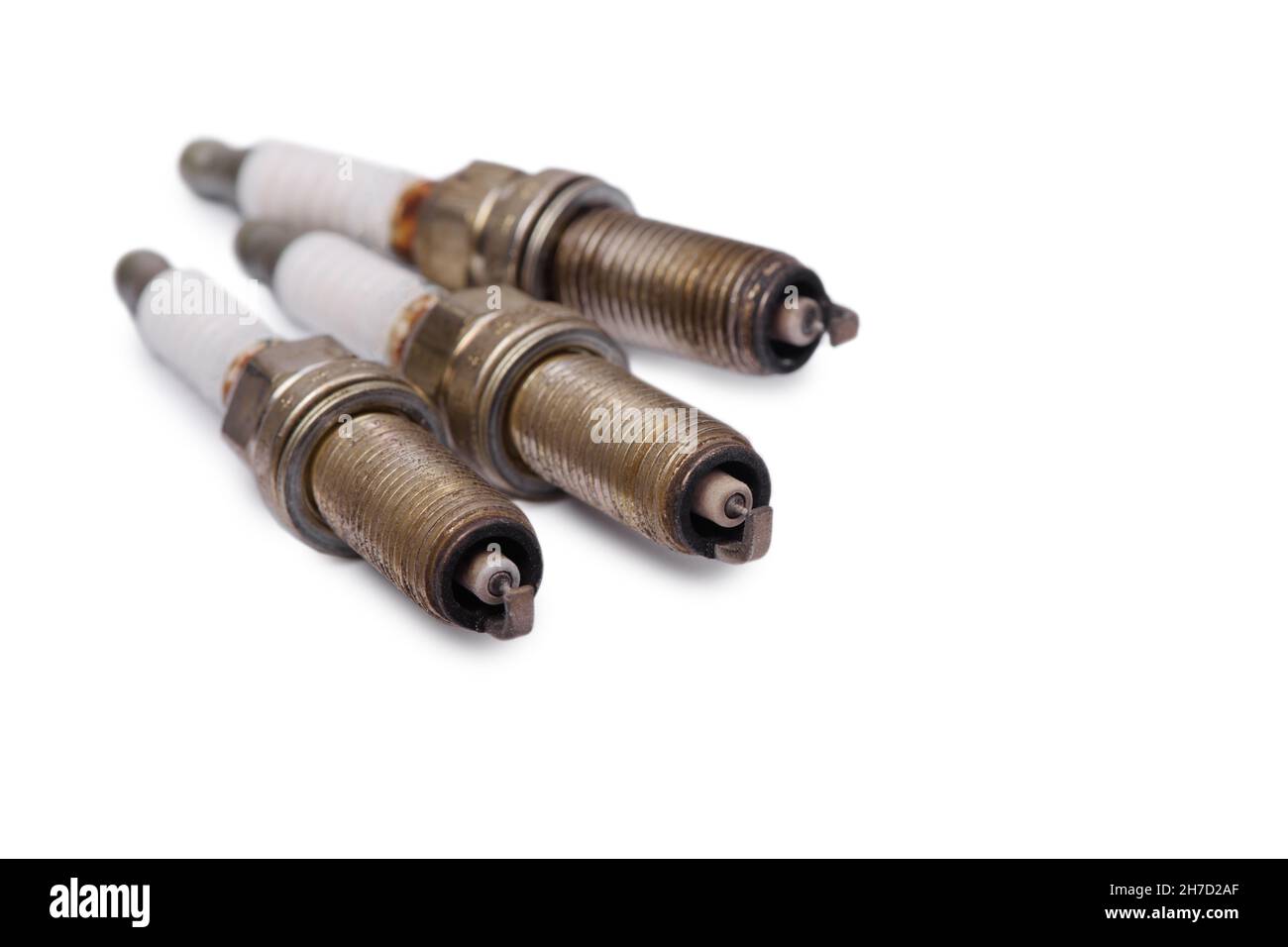 Old used spark plug isolated on white background Stock Photo - Alamy
