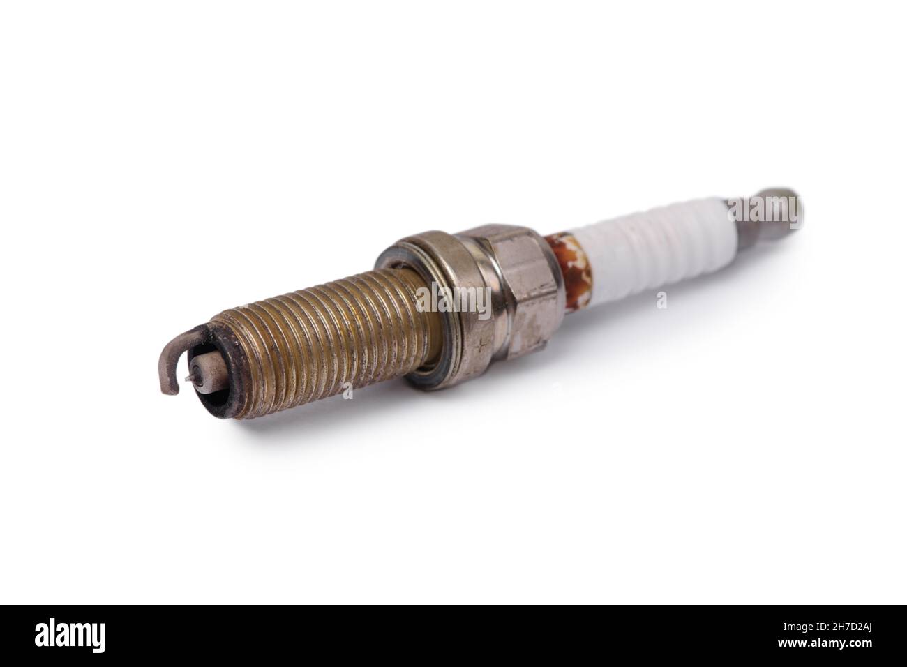 Old used spark plug isolated on white background Stock Photo - Alamy