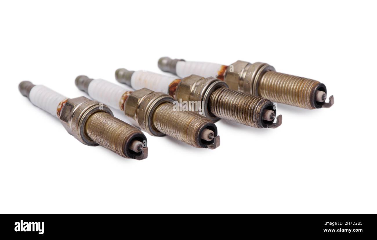 Old used spark plug isolated on white background Stock Photo - Alamy
