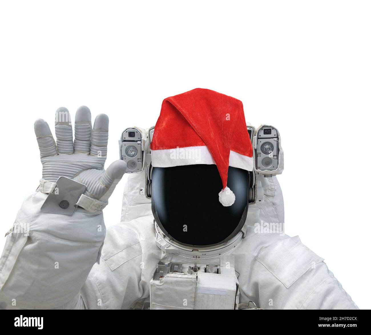 Astronaut in red santa hat raise hand as greeting. Isolated on white ...