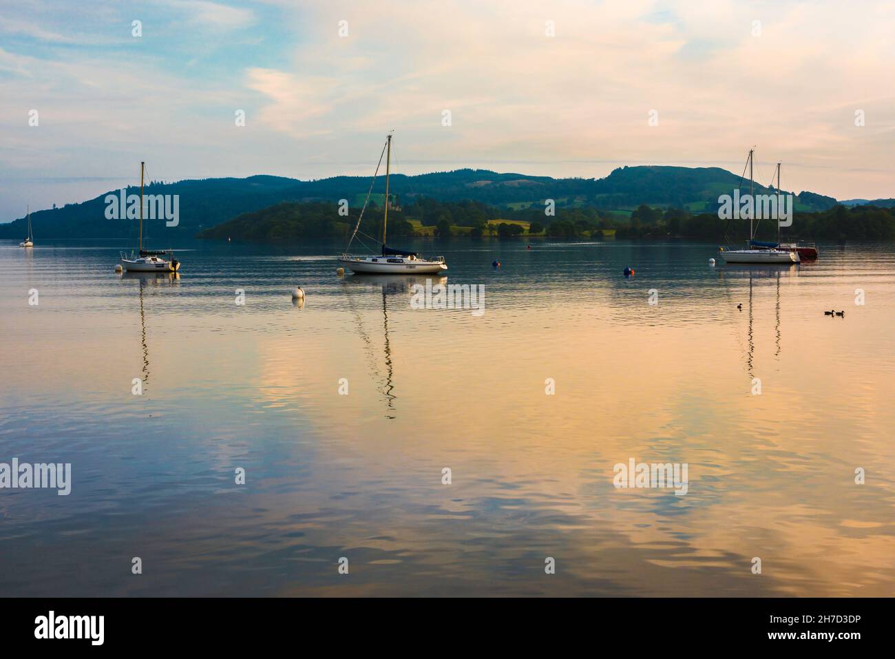 English Lakes, view on a summer evening of boats moored in Waterhead, a ...