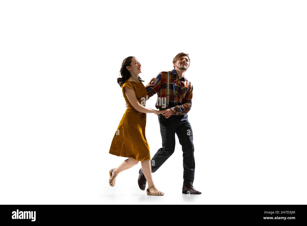Two dancers, young man and woman in old-school fashioned attire dancing ...