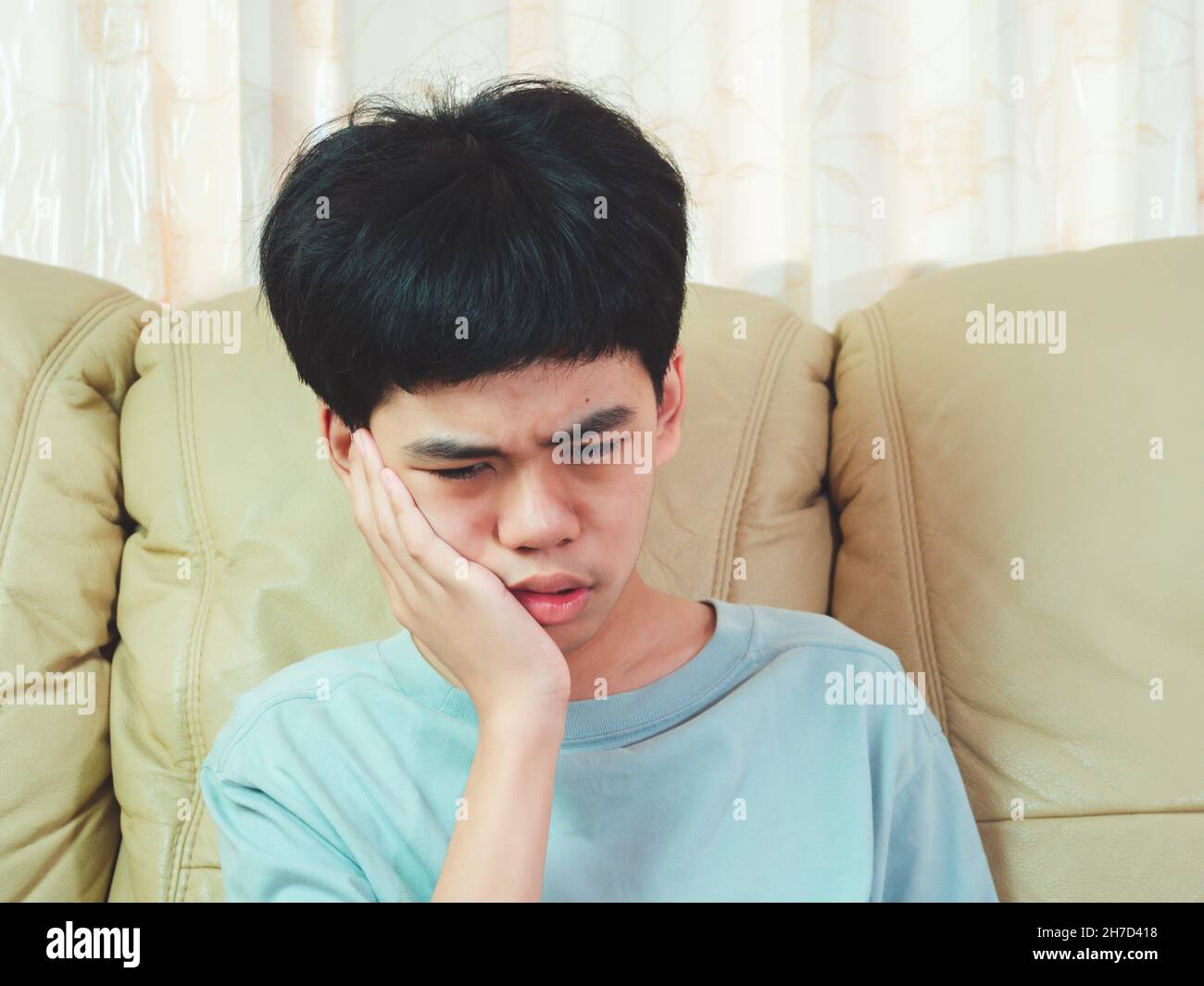 Little asia boy suffer from toothache. He sad with tooth pain, dental ...