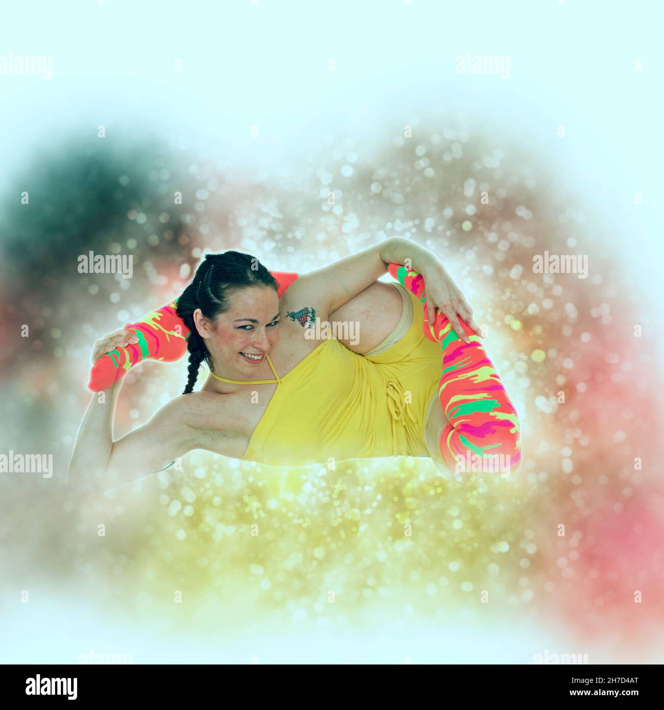 Young flexible woman On white Background Stock Photo - Alamy