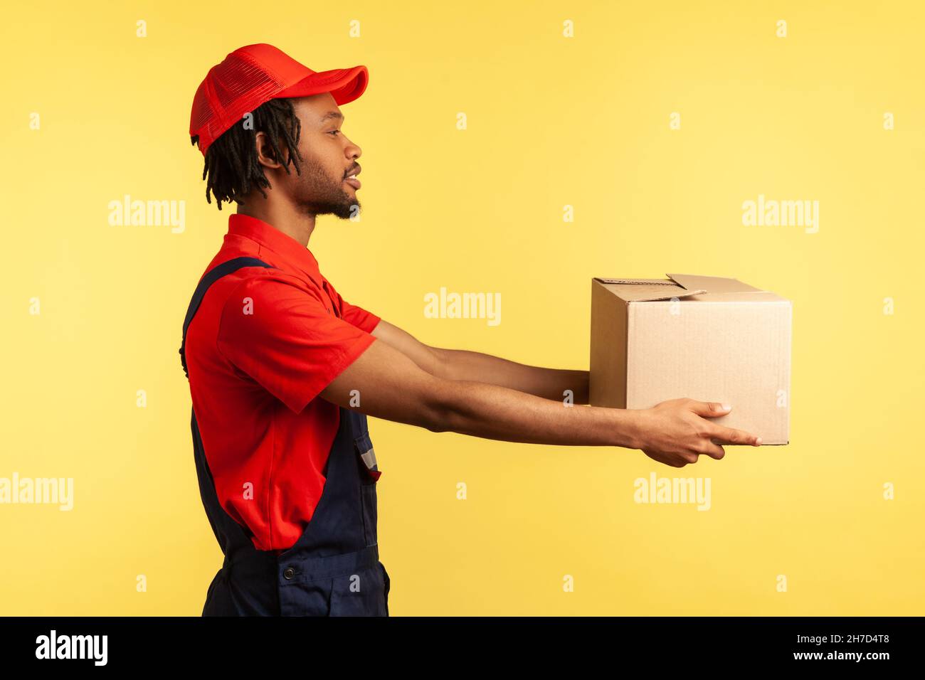African delivery man carrying parcel hi-res stock photography and ...