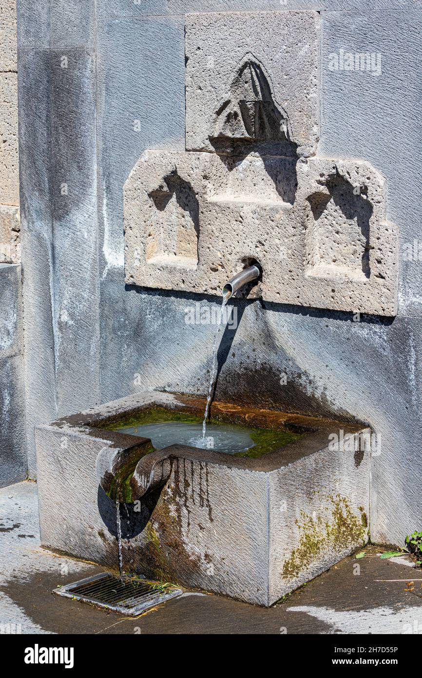 Mineral water spring outdoors. Pure and potable fountain at city street ...