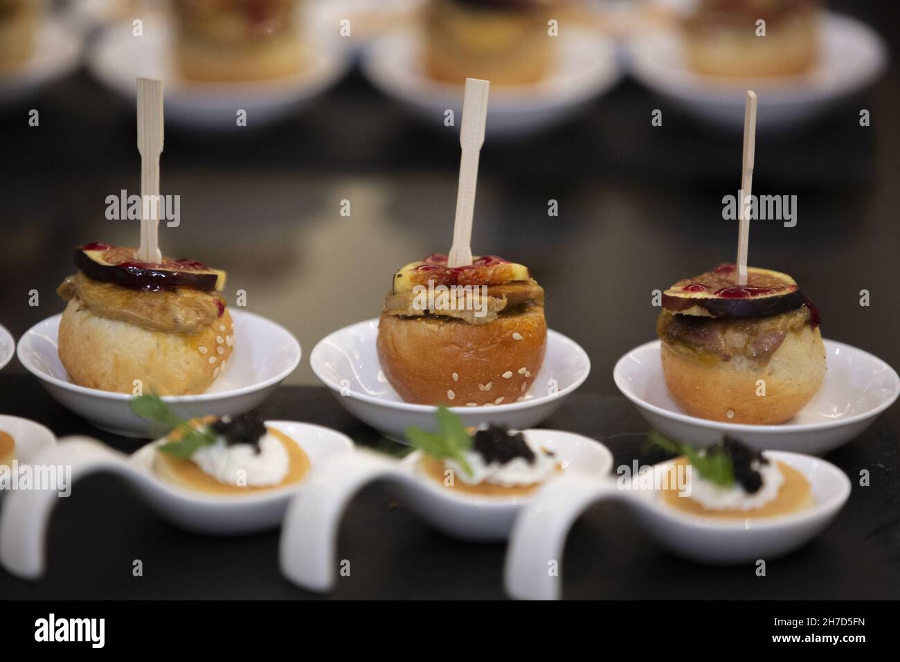 Set of small burgers and sandwiches on a banquet table Stock Photo - Alamy
