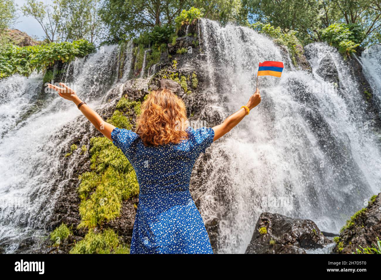 Happy woman traveler with armenian flag is resting near the beautiful ...