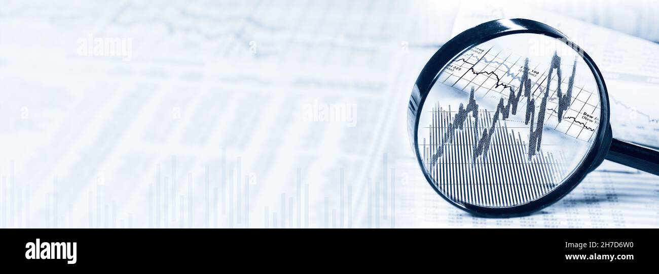 Magnifying glass with rising stock prices and free copy space Stock ...