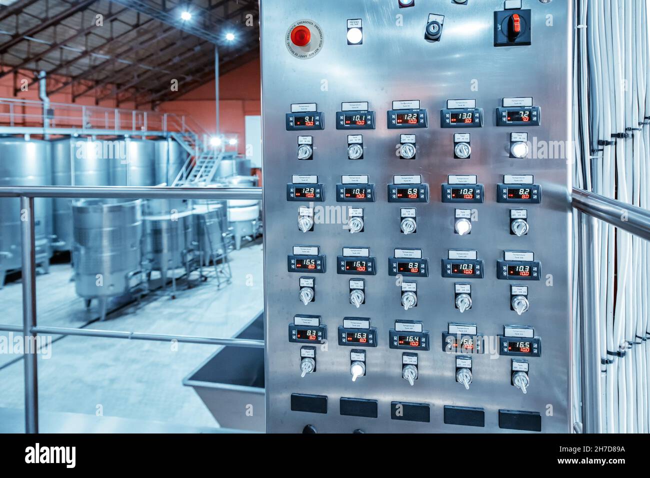 A control panel with toggle switches and indicators of temperature and ...