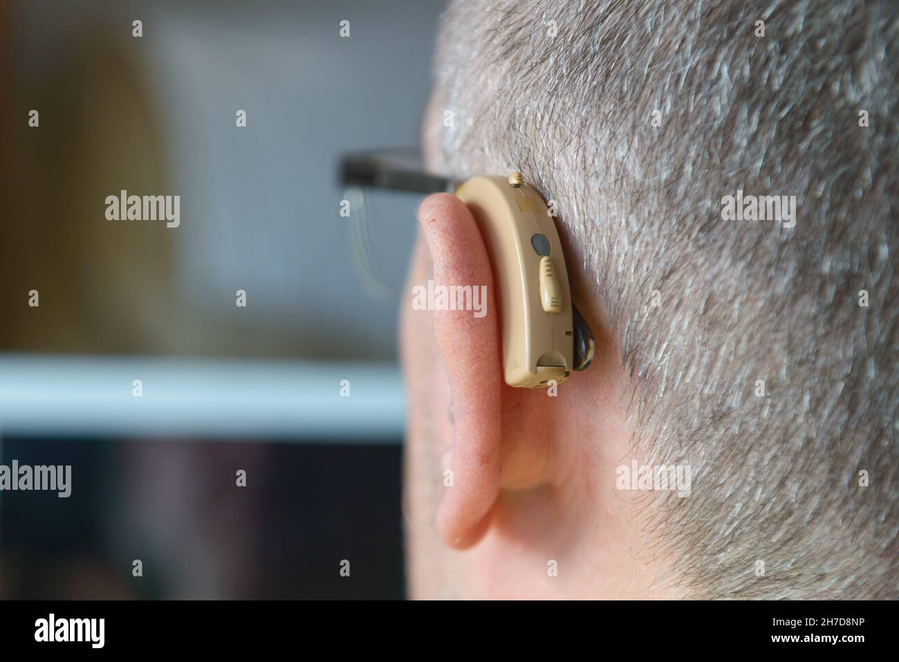 Close-up of a hearing aid placed in the ear of a deaf man Stock Photo ...