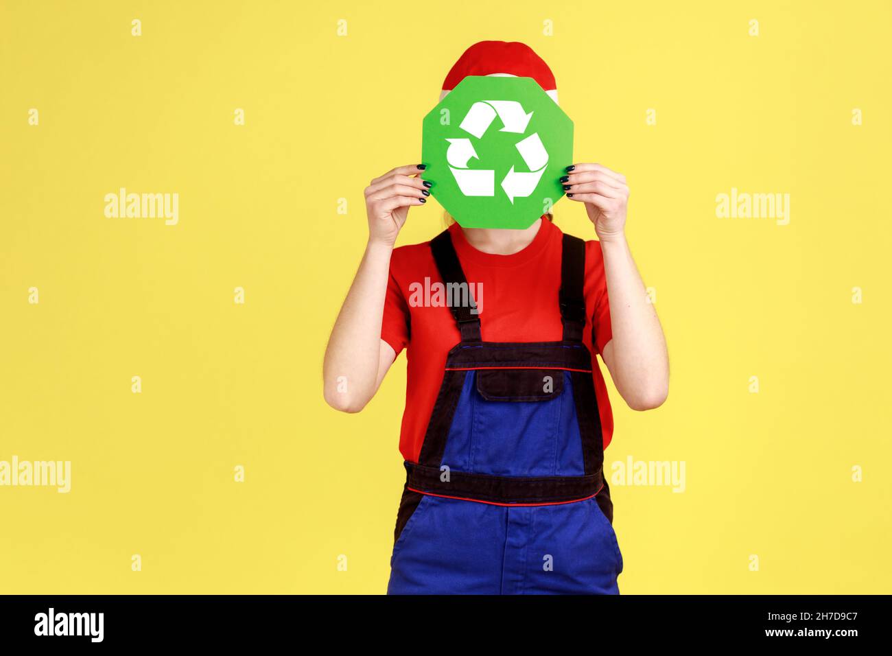 Portrait of unknown anonymous worker woman standing hiding her face ...