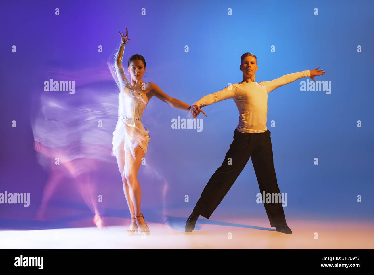 Dynamic portrait of graceful dancers, flexible man and woman dancing ...