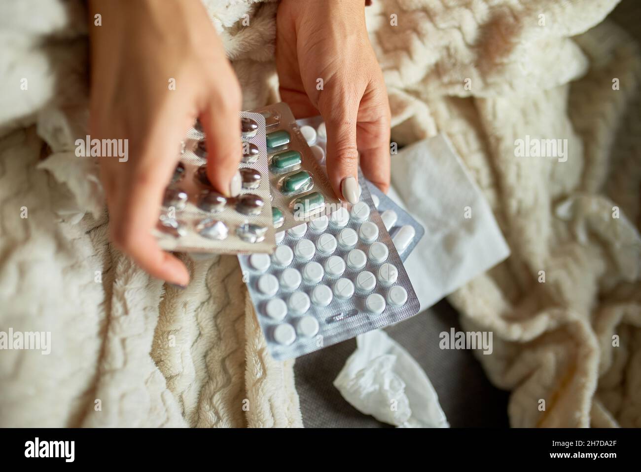 Top view Sick woman looking blister of medicine in hand Stock Photo - Alamy