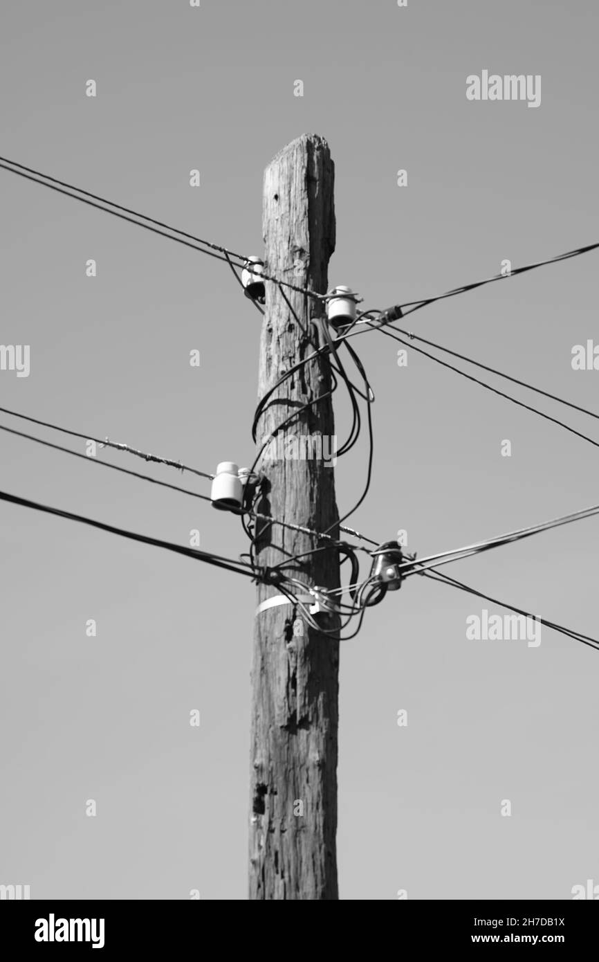 Old wooden pillar in clear sky background. BW photo Stock Photo - Alamy