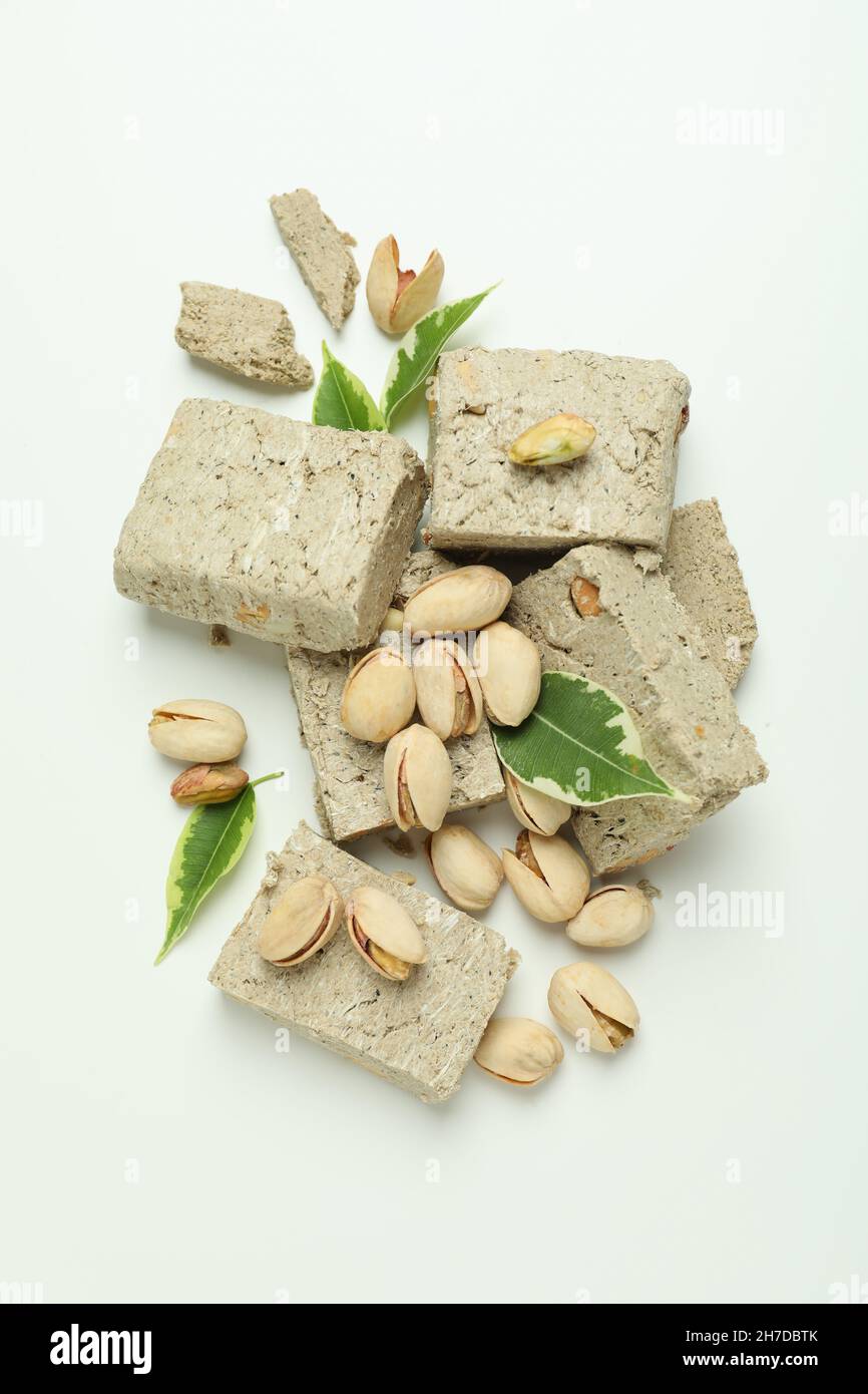 Halva with pistachio and leaves on white background Stock Photo - Alamy