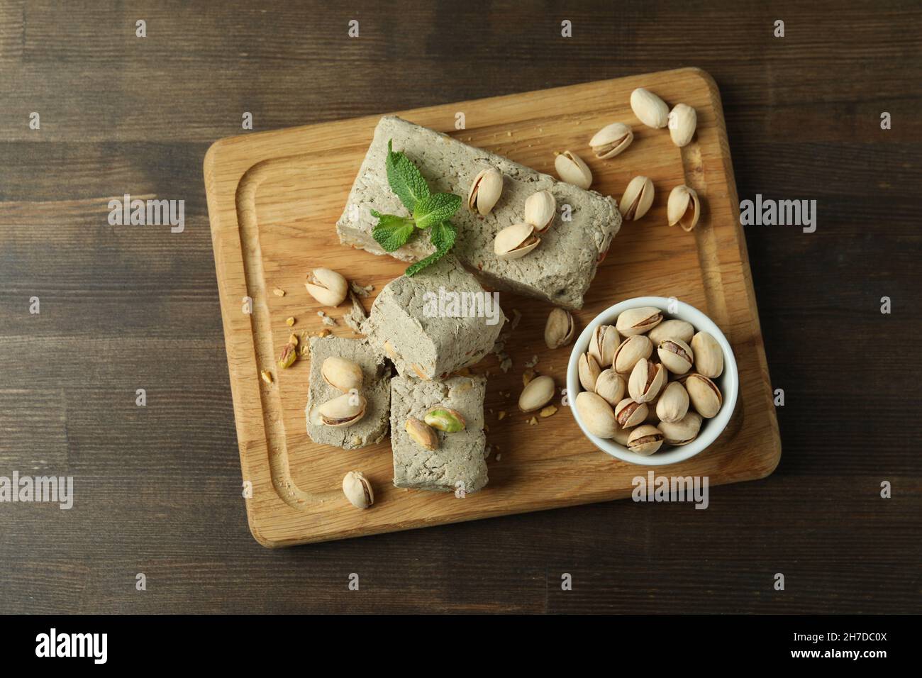 Concept of tasty food with halva on wooden background Stock Photo - Alamy