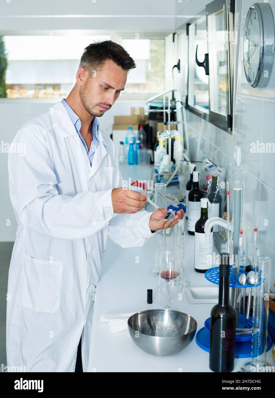 Man in chemical laboratory on winery Stock Photo - Alamy