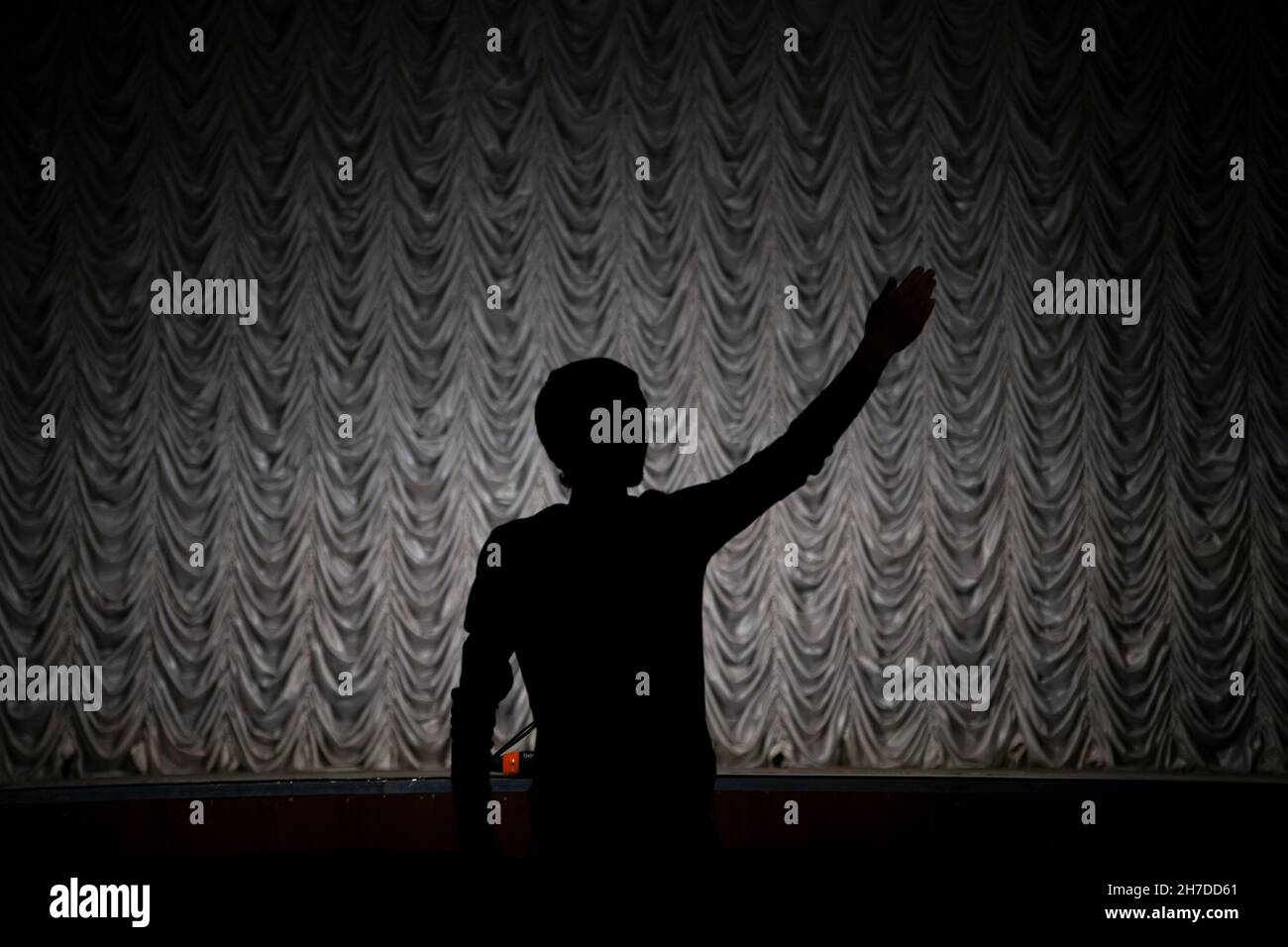 Silhouette of the director. A man directs a play. Hand gesture. Young ...